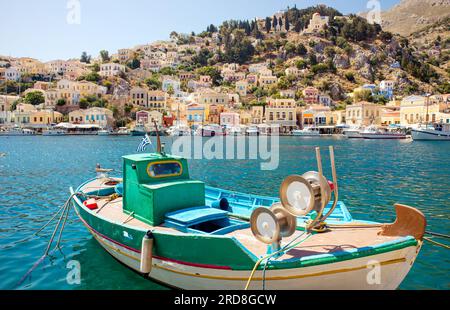 A beautiful view of the Symi Harbor on Symi Island, Greece with boats ...