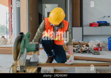 Structural worker dressed in safety gear and hard hat doing ...