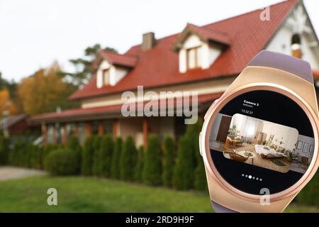 Home security system. Modern smartwatch with image of room through CCTV ...