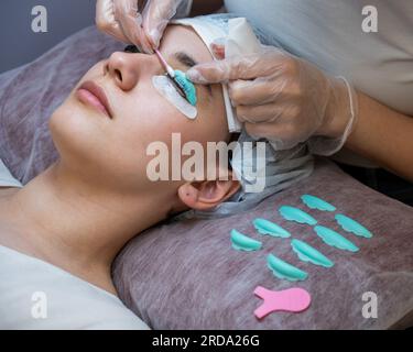 The master removes the composition for lamination from the client's ...