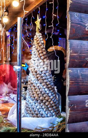 Creative Christmas tree made of shells background of sea sand. Concept ...