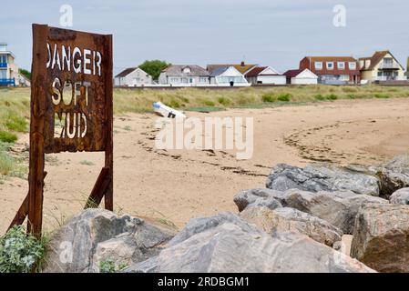 Danger Soft Mud warning sign on the beach Stock Photo - Alamy