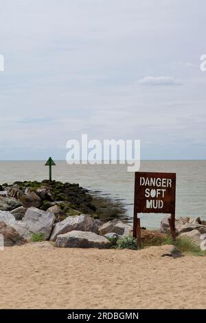 Danger Soft Mud warning sign on the beach Stock Photo - Alamy