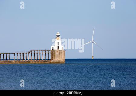 Blyth Pier Lighthouse and offshore wind turbine, Northumberland Stock ...
