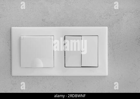 Closed socket and switch on porcelain stoneware in the bathroom Stock ...