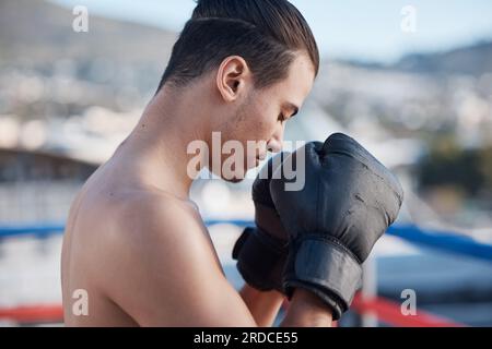 Fitness, boxer praying or man fighting in a ring on rooftop in city for ...