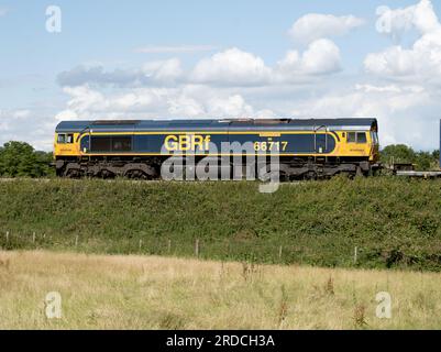 Old locomotive pulling freight train. India Stock Photo - Alamy