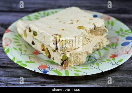 Traditional tahini halva with pistachios or Halawa Tahiniya, the ...