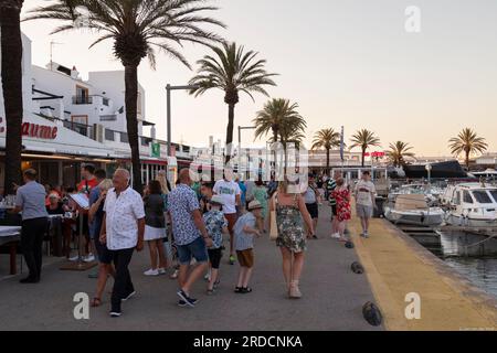 Cozy restaurants on the harbor in the seaside resort of Cala en Bosc on ...