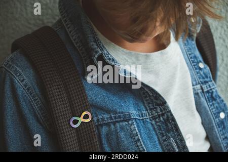 Young boy with autism infinity rainbow symbol sign. World autism ...
