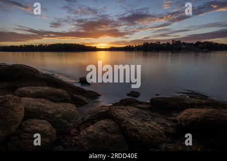 An early November sunset reflects off the surface of Lake Lanier at ...