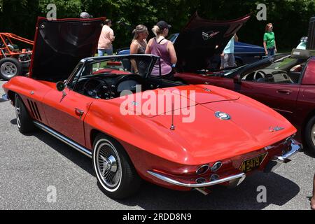 A 1965 Red C2 Chevrolet Corvette Convertible on display at a car show ...