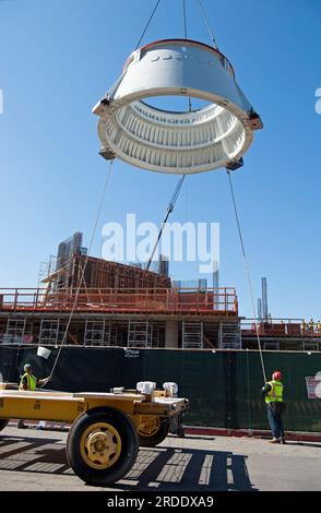 One of the aft skirts of the Endeavor Space Shuttle being lifted by ...