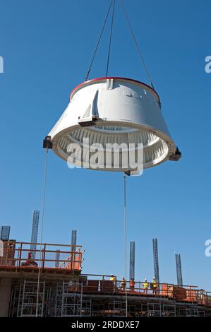 One of the aft skirts of the Endeavor Space Shuttle being lifted by ...