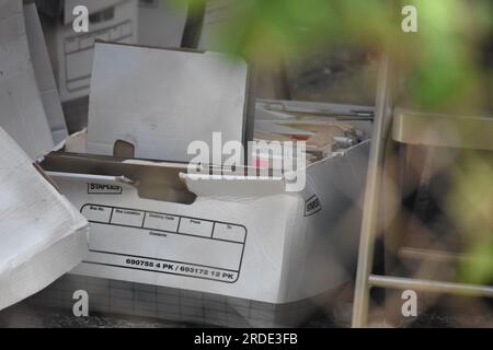 Boxes of evidence being searched and cataloged at the storage unit at ...