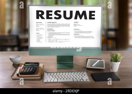Businessmen Reading Resumes for a new job use laptops and CVs in the ...