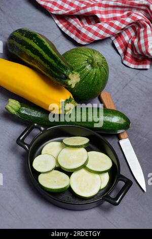 Various courgettes (Cucurbita pepo), courgettes cut up in pot convar ...
