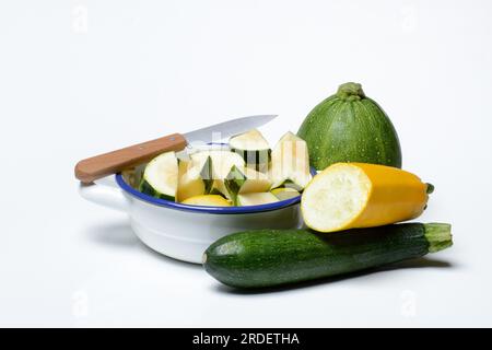 Various courgettes (Cucurbita pepo), courgettes cut up in pot convar ...