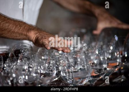 Musician plays a series of crystal glasses which make up a rare ...