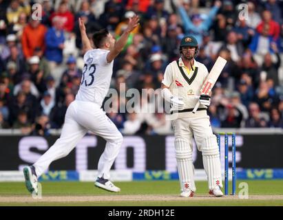 Australia's Travis Head, fourth left, walks off the field after losing ...