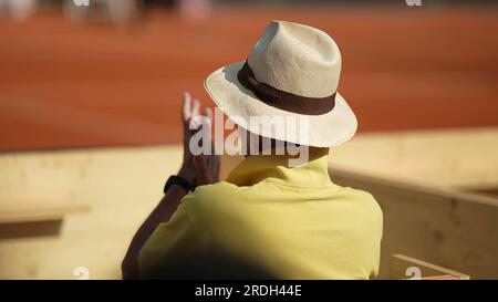 Spectator watching tennis match game clapping hands cheering from ...