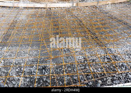 Welded wire mesh, WWM, installed within a sidewalk concrete form prior ...