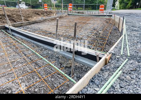 Welded wire mesh, WWM, installed within a sidewalk concrete form prior ...