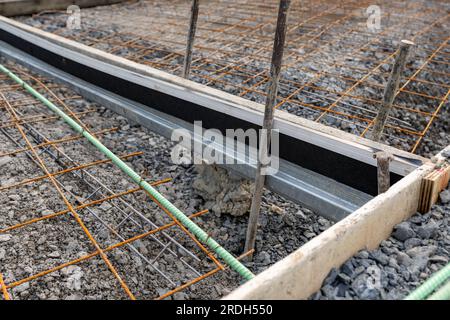 Welded wire mesh, WWM, installed within a sidewalk concrete form prior ...