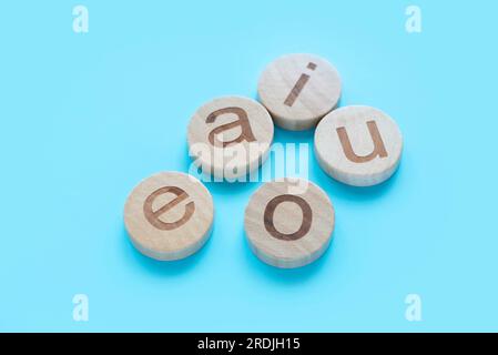 Learning english concept.Vowels of AEIOU on a blue background. Copy ...