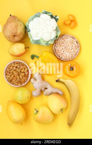 A top view of apples, ginger root, blueberries, and seasoning on a ...