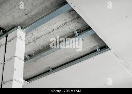 Suspended ceiling structure with profiles for installation of ceiling ...