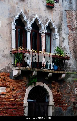 Byzantine-Gothic ogee arched window and balconys with balustrades in ...