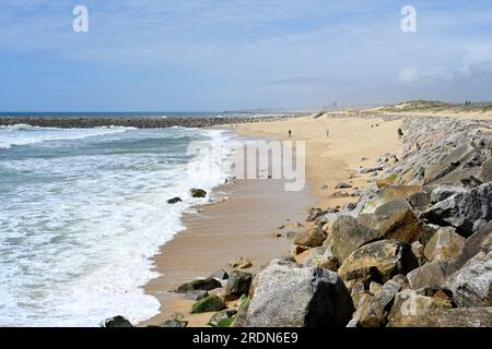 Praia de Paramos, long sandy beach with stone sea defences by Espinho ...
