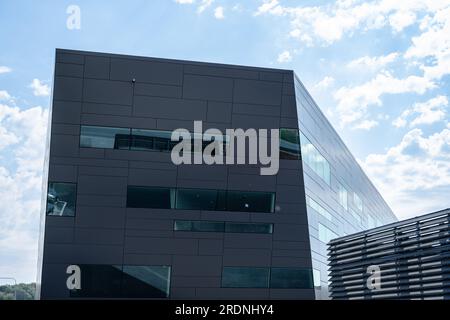 Large dark office building with odd angles Stock Photo - Alamy