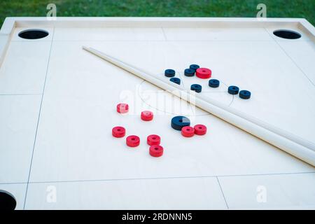 Novuss table with discs and cue stics Stock Photo - Alamy
