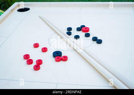 Novuss table with discs and cue stics Stock Photo - Alamy