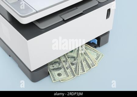 Laser printer with dollar banknotes on light background Stock Photo - Alamy