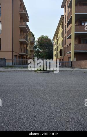 Gates and passageway between residential buildings seen from a street ...