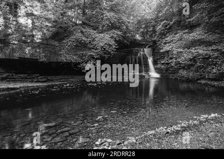 A monochrome shot of West Burton Waterfall also known as Cauldron Falls ...