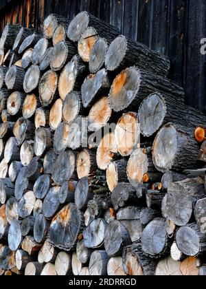Firewood store, unsplit Stock Photo - Alamy