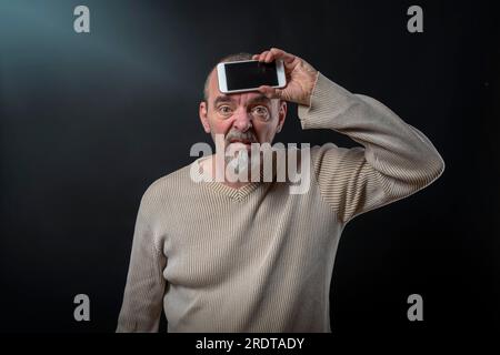 old man does not understand his smartphone Stock Photo - Alamy