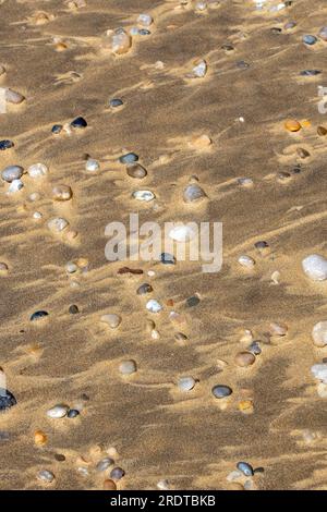 Pebbles on beach creating abstract patterns Stock Photo - Alamy