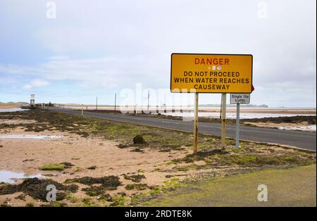 warning signs on the causeway at holy island off the northumberland ...