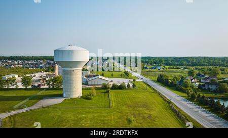 Rural area with housing and nondescript white water tower aerial Stock ...