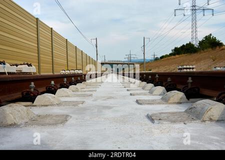 New railroad track. Laying of ICE fast track. Construction site with ...