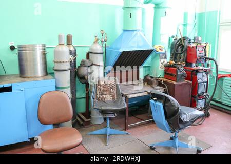 Welding post, table for work of a welder in a workshop at a ...