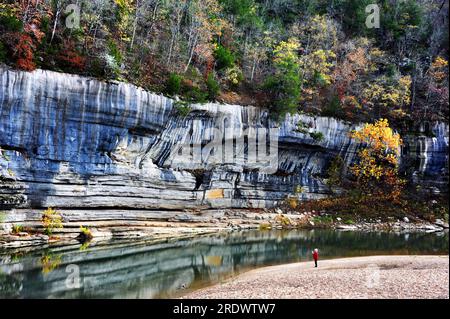 Tall cliffs of the Buffalo National River is streaked with grey, black ...