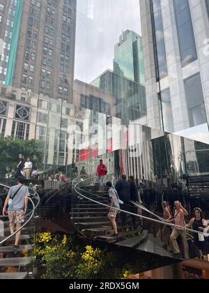 People exit an Apple store on Fifth Avenue in Manhattan, New York City ...