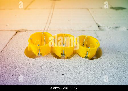 Triple yellow installation box for a socket in an aerated concrete ...
