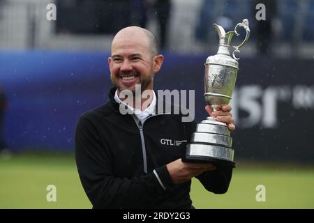 United States' Brian Harman poses with the Claret Jug trophy after ...